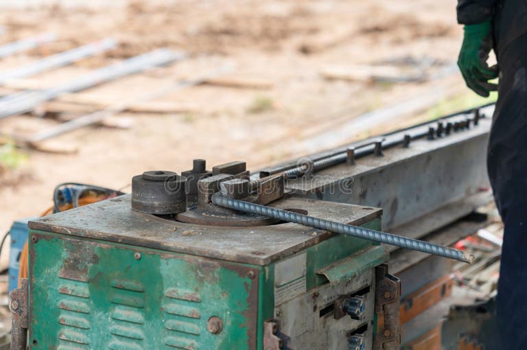 A Construction Worker is Operating a Rebar Bender on-site Stock Image ...