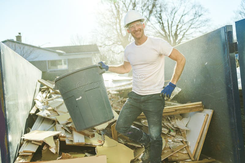 Construction Worker Outside of House Put Old Renovation Material on Big ...