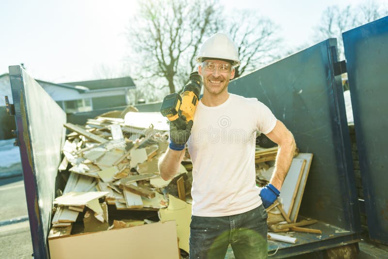 Construction Worker Outside of House Put Old Renovation Material on Big ...