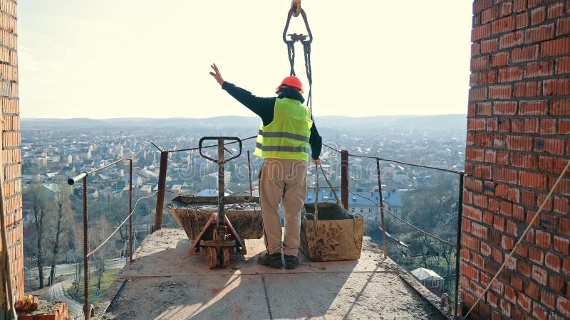 Construction Worker Overlooking Town, a Construction Worker in a High ...