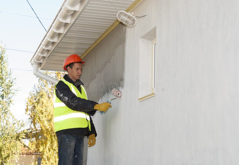 Master paints the house stock image. Image of painting - 136541301