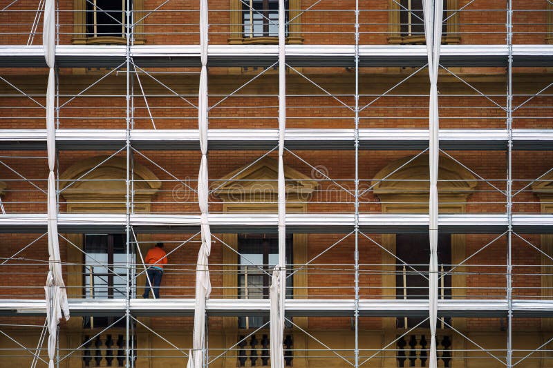 Construction Worker Performing Maintenance on a Historical Building ...