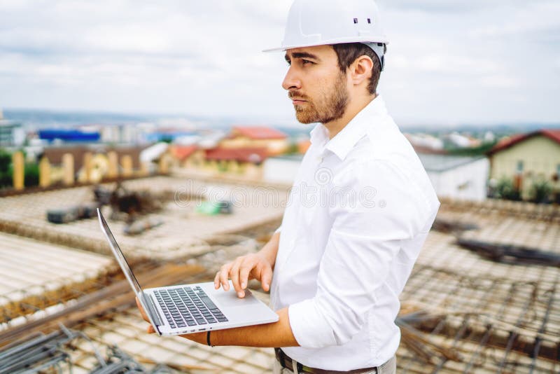 Worker Planning with Laptop, Using Technology at Construction Site ...