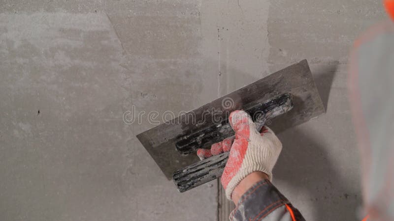 Construction Worker Plastering Interior Concrete Wall Using Trowel ...