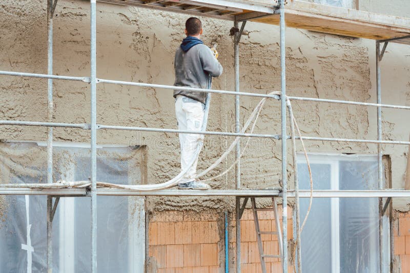 Worker Plastering Outer Wall of Newly Built House Stock Photo - Image ...