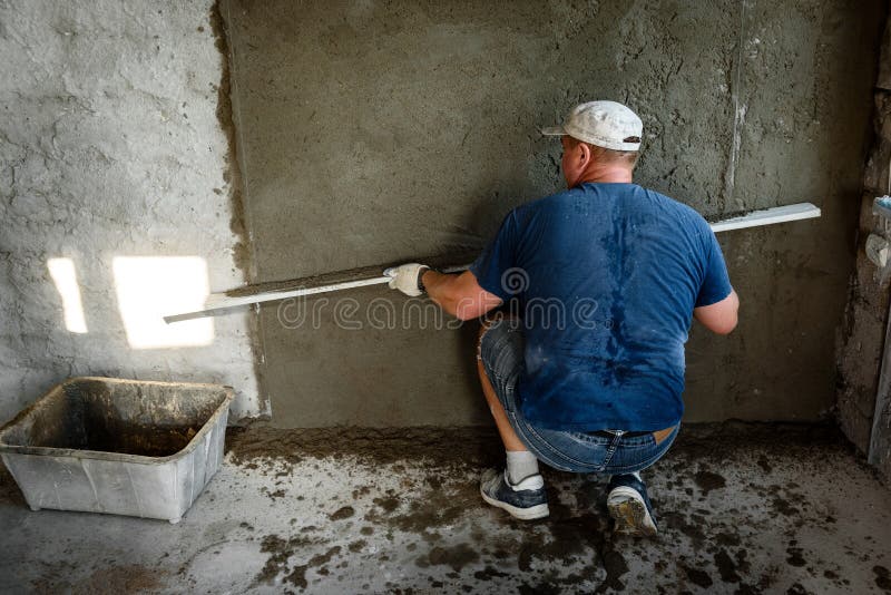 Construction Worker Plastering Wall with Leveler Stock Image - Image of ...