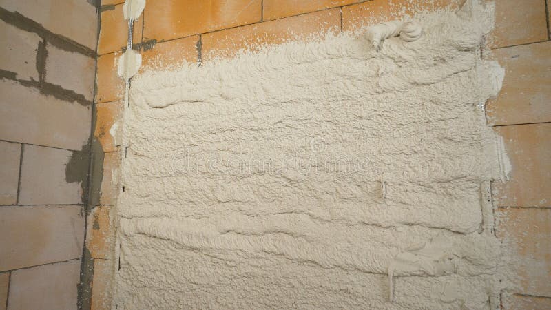 Plastering a Wall with Trowel: Construction Work in Progress Stock ...