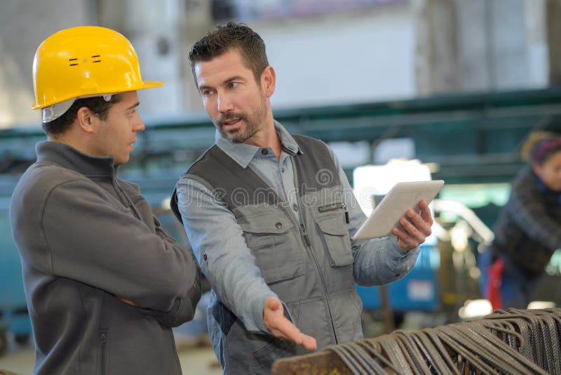 Construction Worker Pointing at Digital Tablet Close-up Stock Photo ...