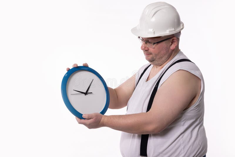 A Construction Worker is Taking a Moment To Check the Time Using a ...