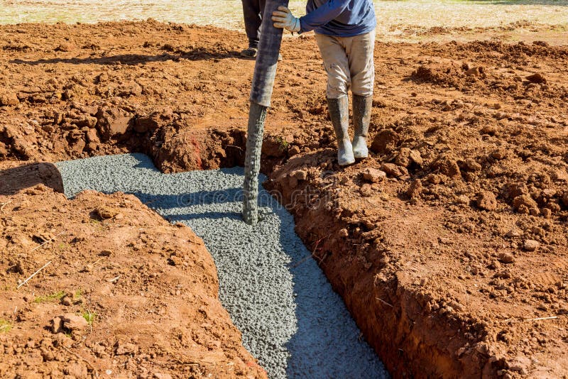 Construction Worker is Pouring Cement Concrete by Using an Automatic ...