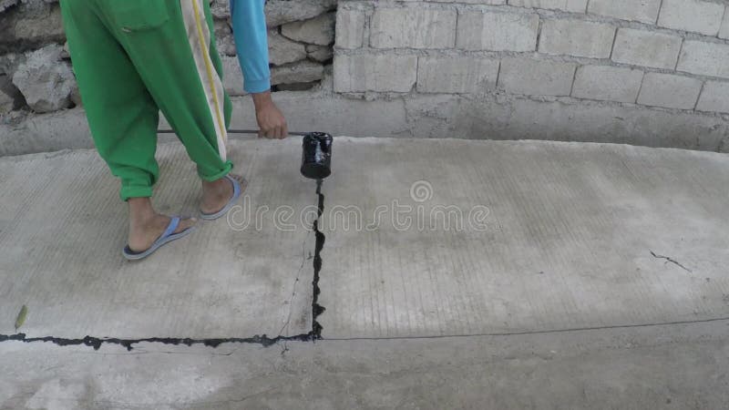 Construction Worker Pouring Hot Melted Asphalt between Road Junction ...