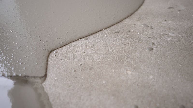 Construction Worker Pouring Self Leveling Concrete on the Floor. Stock ...