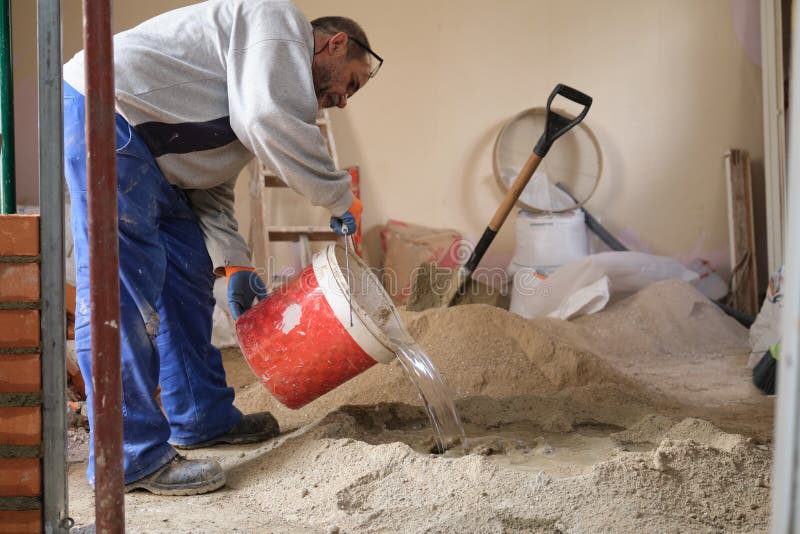 Construction Worker Preparing Cement Stock Photo - Image of holes ...