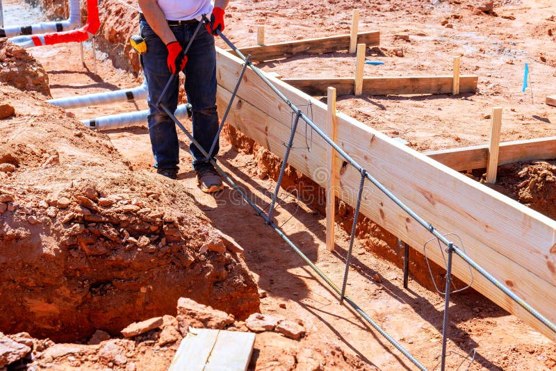 Construction Worker Preparing Foundation with Rebar and Wooden Frames ...