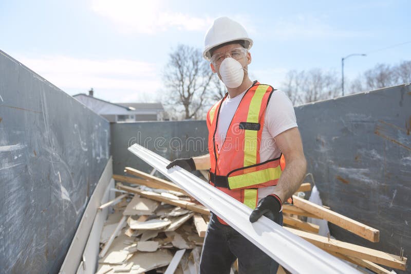 Construction Worker Outside of House Put Old Renovation Material on Big ...