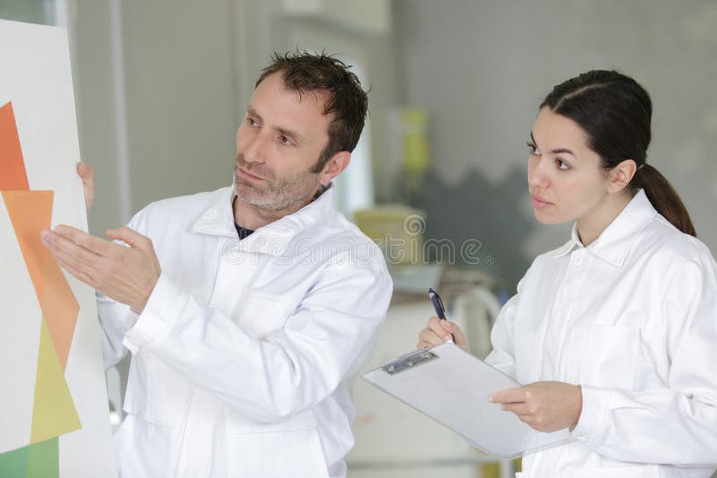 Construction Worker Puts Finishing Touch on Wall Stock Photo - Image of ...