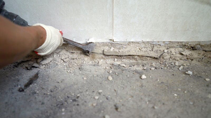 Construction Worker Removing Tiles from Floor with Hammer and Chisel ...