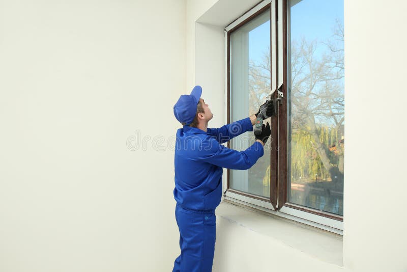 Construction Worker Repairing Window Stock Photo - Image of glazier ...