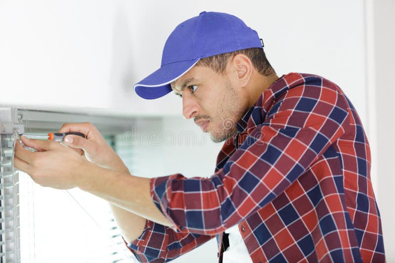 Construction Worker Repairing Window in House Stock Image - Image of ...