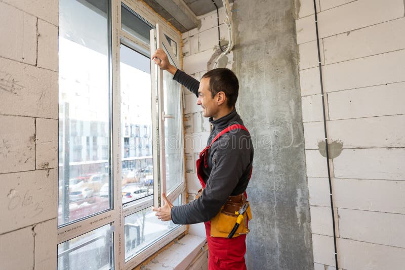 Construction Worker Repairing Windows in House. Stock Image - Image of ...