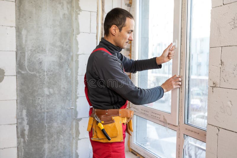 Construction Worker Repairing Windows in House. Stock Photo - Image of ...