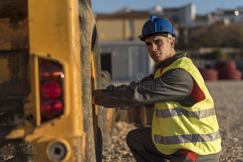 Mechanic in Construction Site Stock Photo - Image of looking, work ...