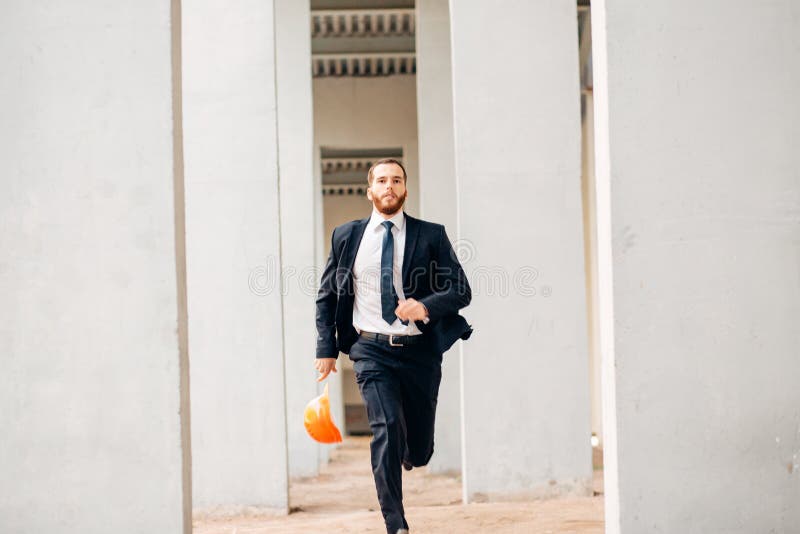 Construction Worker Running from Danger on Construction Site Stock ...