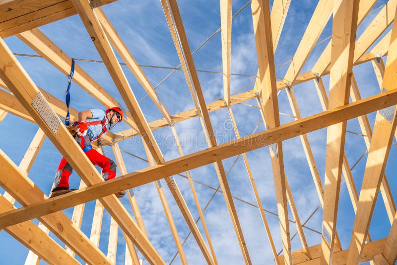 Construction Worker Safely Navigating Wooden Framework at Sunny Site ...