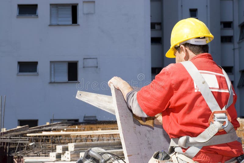Construction Worker Saws Board - Horizontal Picture. Image: 6040513