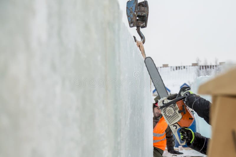 Worker Cuts a Lump of Ice with a Chainsaw Stock Photo - Image of frost ...