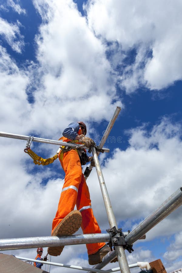 Construction Worker on a Scaffold Stock Image - Image of risk ...