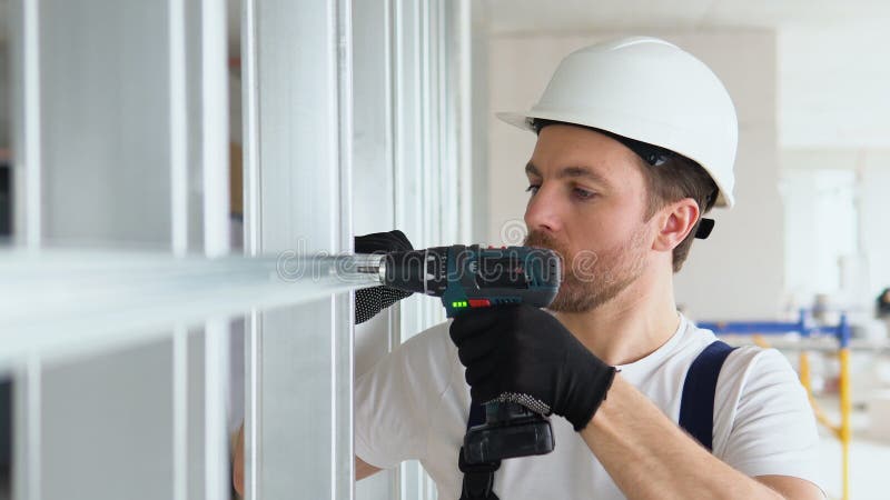 Construction Worker Screws the into the Drywall Rack Stock Video ...