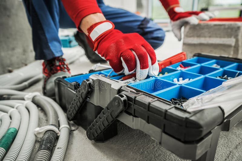 Construction Worker Selecting Right from His ToolBox Stock Image ...