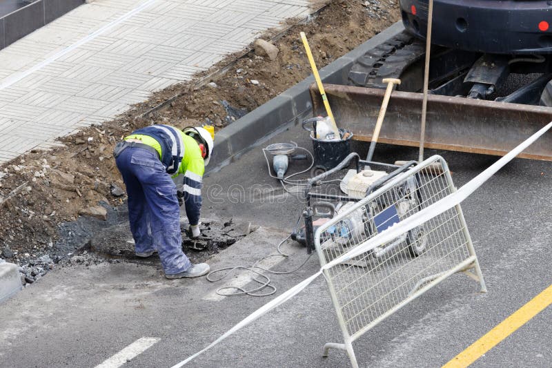 Construction Worker Working on the Renovation of a City Street Stock ...