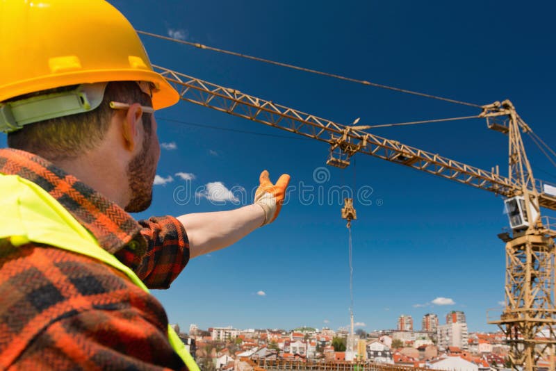 Construction Worker Signaling To Crane Operator Stock Image - Image of ...