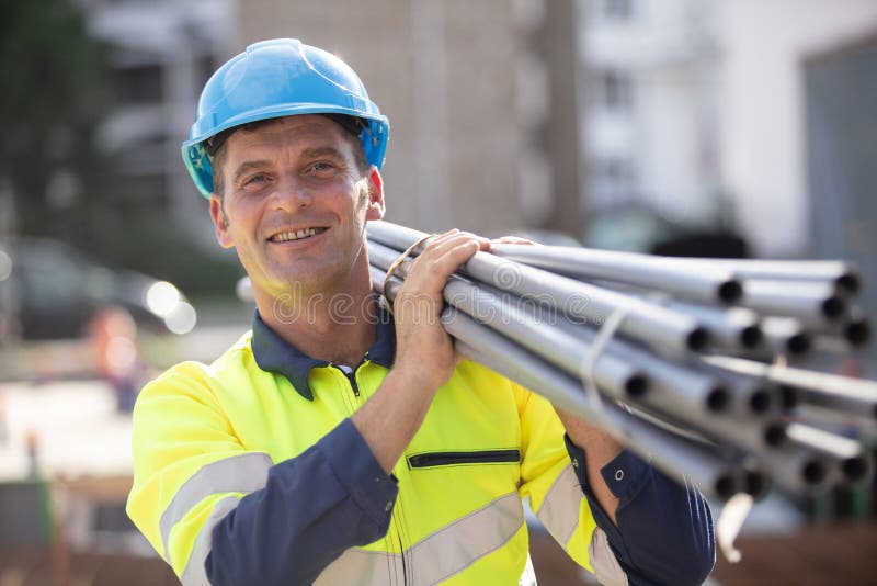 Worker Carrying Pipes Stock Photos - Free & Royalty-Free Stock Photos ...