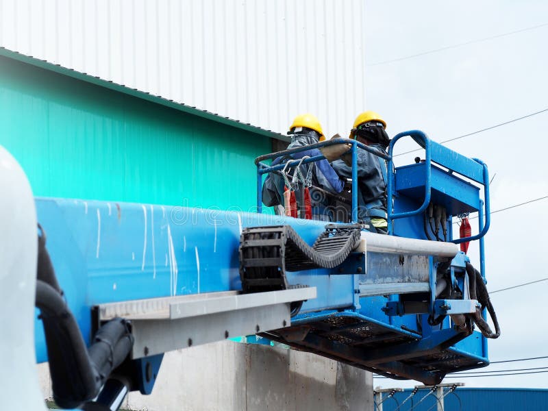 Man Working on the Working at Height on Construction Stock Photo ...