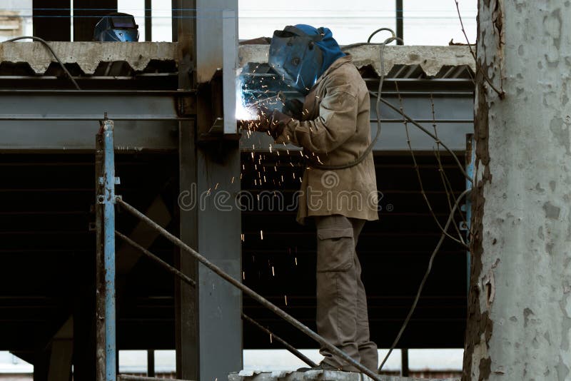Construction Worker at the Site Welding Metal Pipes Stock Photo - Image ...