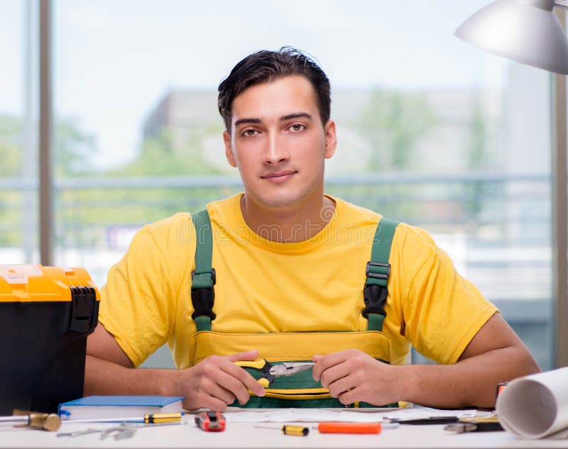 Construction Worker Sitting at the Desk Stock Image - Image of ...