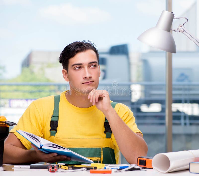 Construction Worker Sitting at the Desk Stock Photo - Image of foreman ...