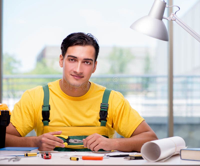 Construction Worker Sitting at the Desk Stock Image - Image of manager ...