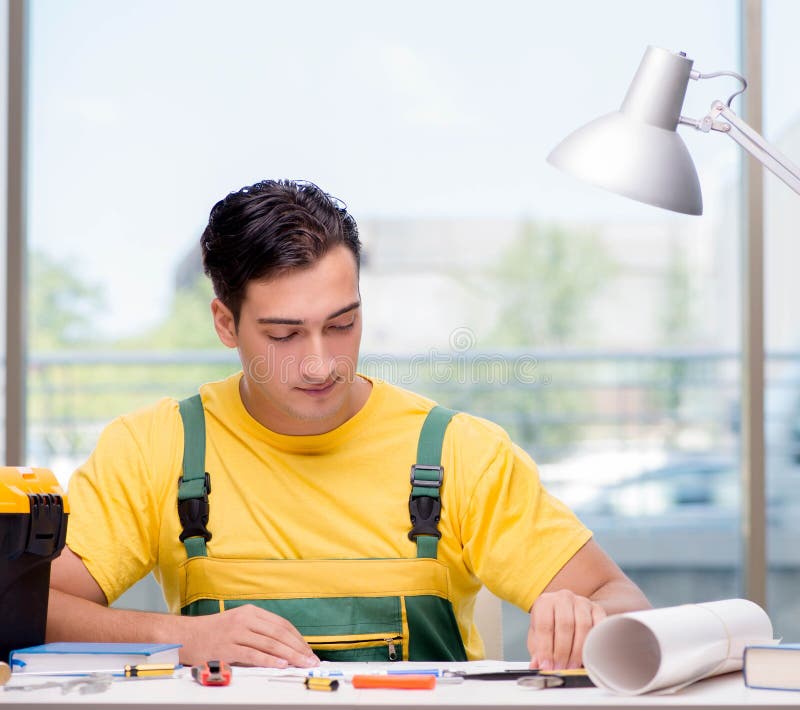 Construction Worker Sitting at the Desk Stock Image - Image of office ...
