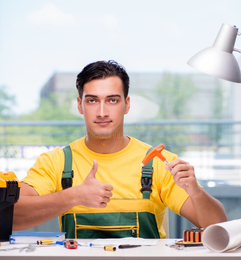 Construction Worker Sitting at the Desk Stock Photo - Image of ...