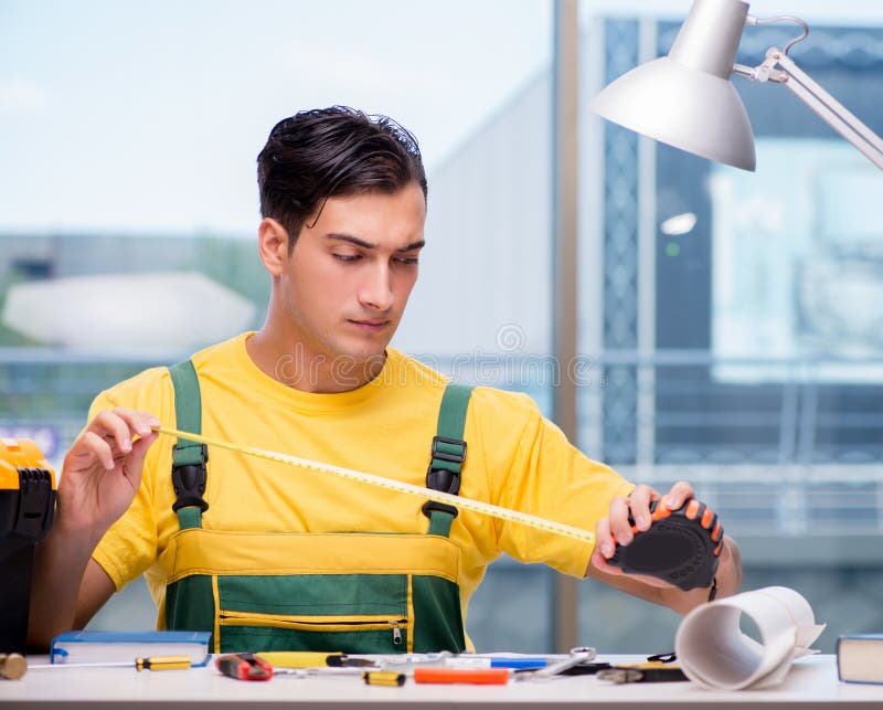 Construction Worker Sitting at the Desk Stock Image - Image of ...