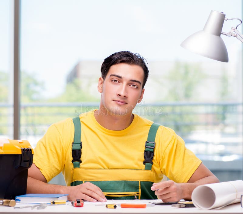 Construction Worker Sitting at the Desk Stock Photo - Image of male ...