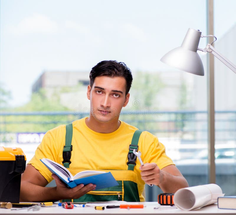 Construction Worker Sitting at the Desk Stock Photo - Image of manual ...
