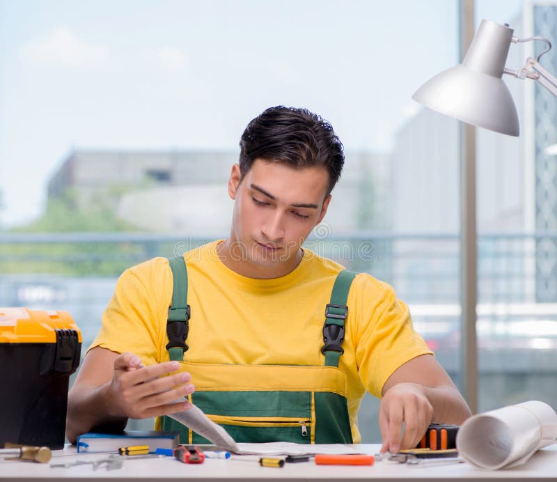 Construction Worker Sitting at the Desk Stock Image - Image of ...