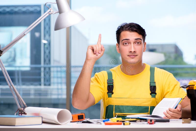 The Construction Worker Sitting at the Desk Stock Photo - Image of ...