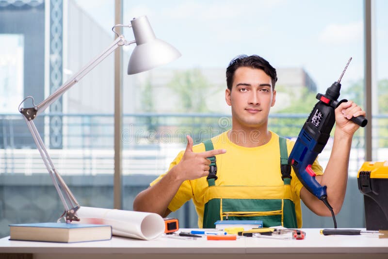 The Construction Worker Sitting at the Desk Stock Photo - Image of ...