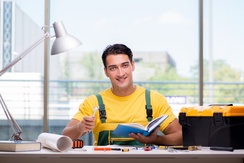 The Construction Worker Sitting at the Desk Stock Photo - Image of ...